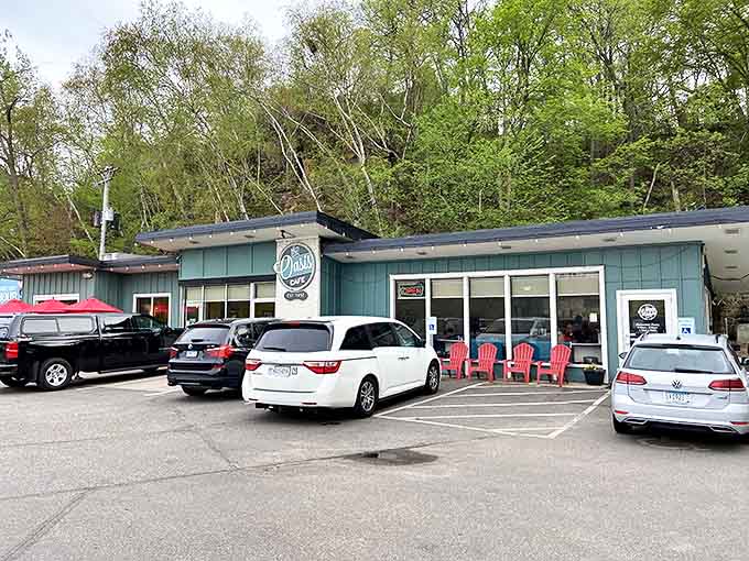 The teal exterior of Oasis Cafe beckons like a culinary oasis amid Stillwater's lush landscape &ndash; a promise of comfort food that never disappoints.