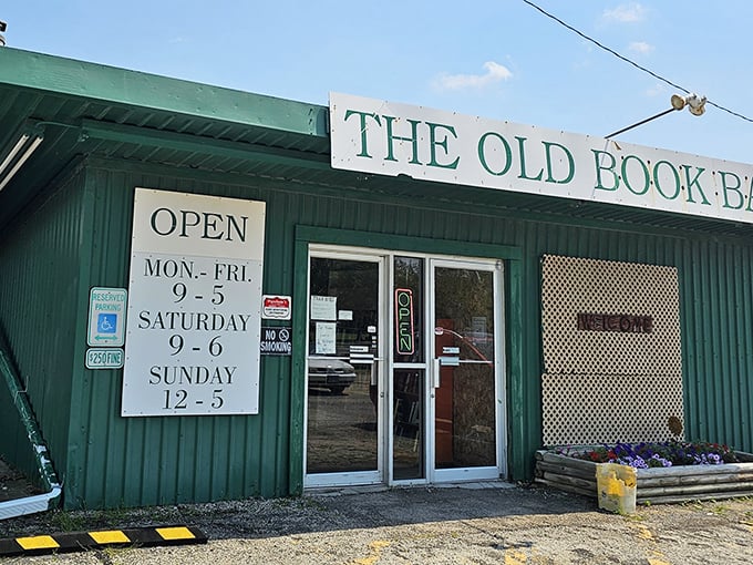 The unassuming green exterior of The Old Book Barn hides a universe of literary treasures within its modest walls.