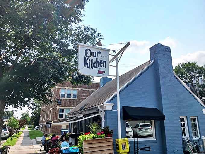 Our Kitchen's blue exterior stands as a beacon of breakfast hope on 36th Street, promising pancake perfection within its humble walls.