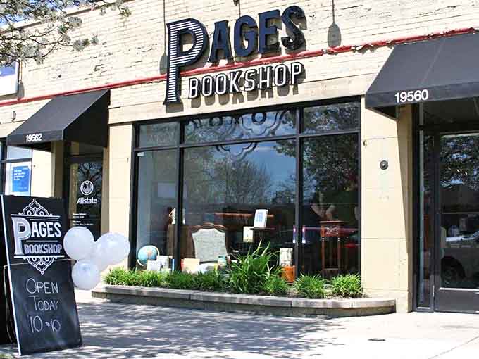 The inviting cream-brick fa&ccedil;ade of Pages Bookshop stands proudly on the street, its bold signage promising literary adventures within Detroit's cultural landscape.