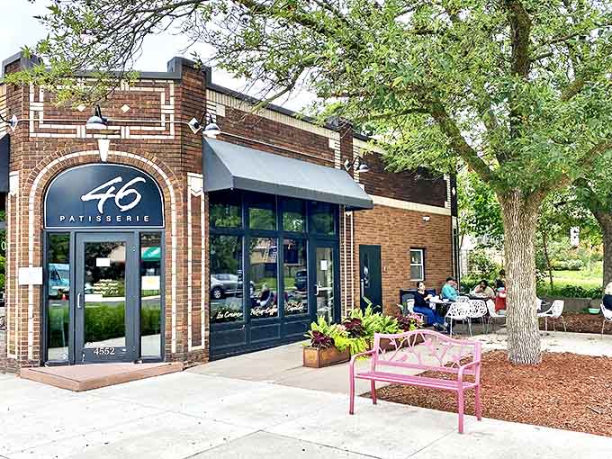 Patisserie 46's charming brick fa&ccedil;ade welcomes visitors with European flair, its distinctive "46" sign promising delectable treasures within.