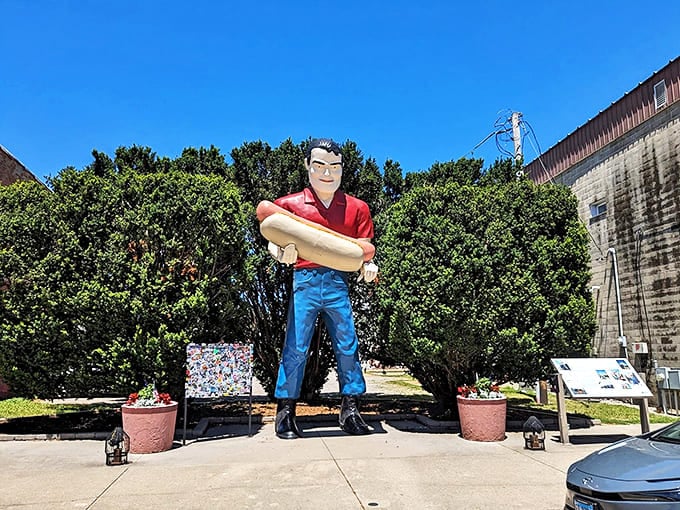 The Bunyon Giant stands tall against the Illinois sky, his hot dog held high like a beacon for hungry travelers.