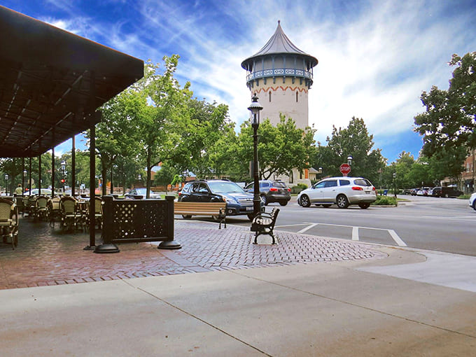 Riverside's iconic water tower stands tall against a brilliant blue sky, a Victorian sentinel watching over this architectural wonderland.