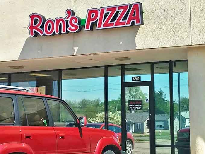 That iconic red sign isn't just a logo – it's a beacon of hope for pizza lovers who know the difference between good and transcendent.