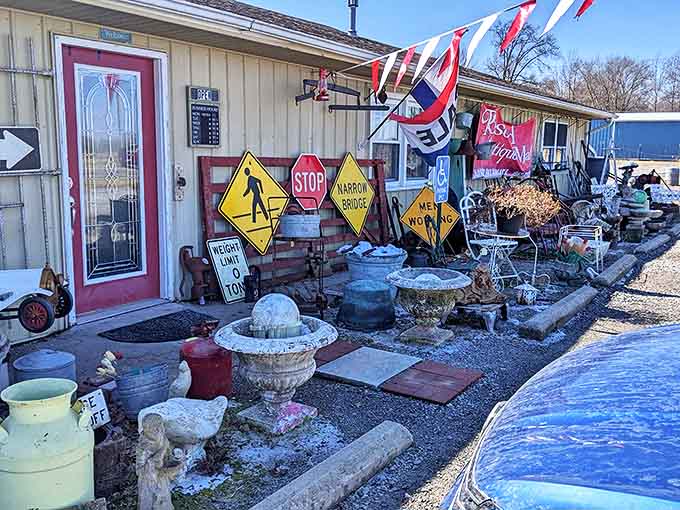 The exterior of Rosebud Antique Mall welcomes treasure hunters with vintage road signs, garden ornaments, and that irresistible "what's inside?" allure that makes antique lovers' hearts race.