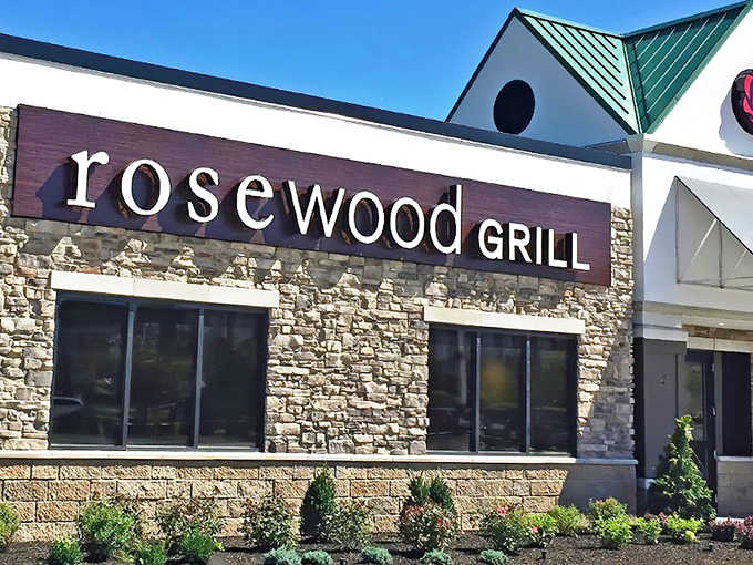 Rosewood Grill's stone facade welcomes hungry visitors like a culinary castle, promising delicious treasures within its welcoming walls.