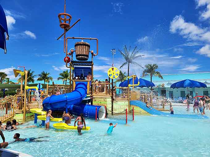 The ultimate Florida heat remedy: a massive water playground where kids squeal with delight while parents secretly enjoy the cooling mist just as much.