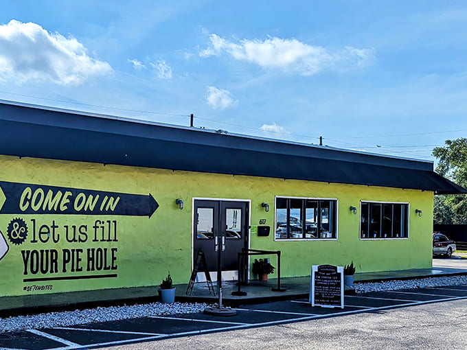 The lime-green beacon of culinary delight beckons with a cheeky promise to "fill your pie hole" &ndash; a sign that knows exactly what you need.