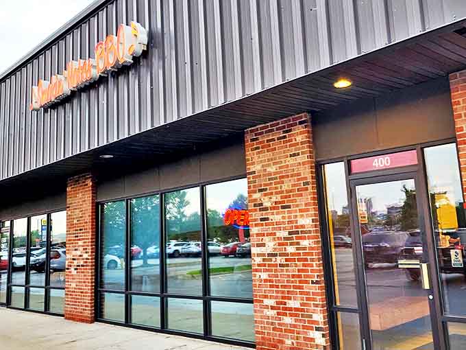 Smokin' Notes BBQ's exterior might be unassuming, but that red neon sign promises smoky treasures within this East Peoria gem.