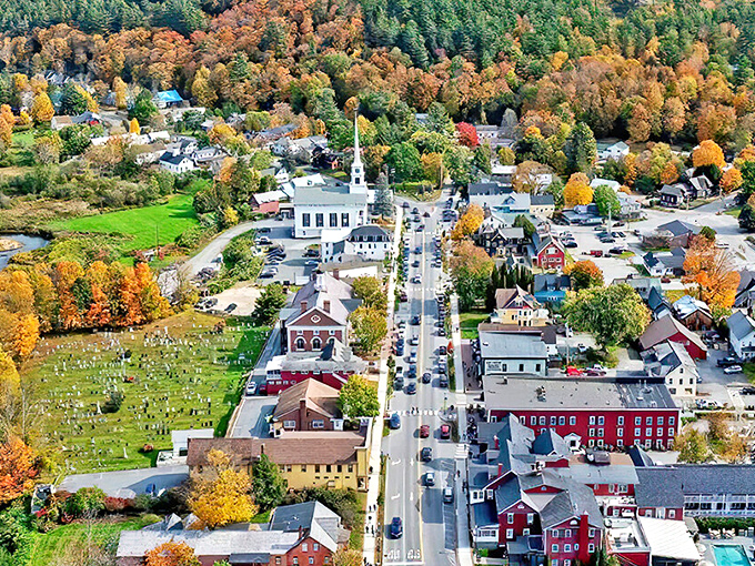 Stowe's picture-perfect downtown unfolds like a New England dream, with white church steeples punctuating a canvas of autumn brilliance.