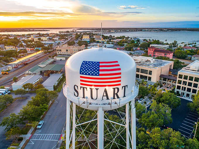 Stuart's iconic water tower stands proud against a Florida sunset, a beacon for travelers seeking coastal charm without the crowds.