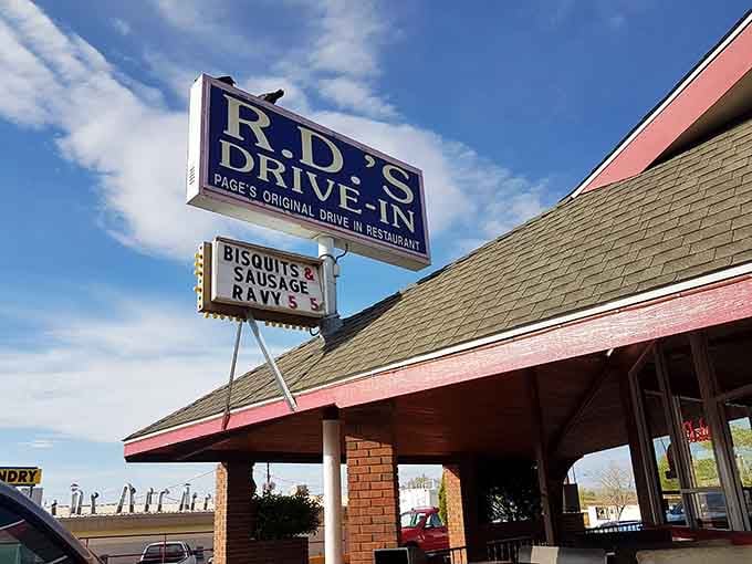 That classic drive-in sign beckons like a beacon of deliciousness, promising the kind of meal that'll make your taste buds stand up and salute.