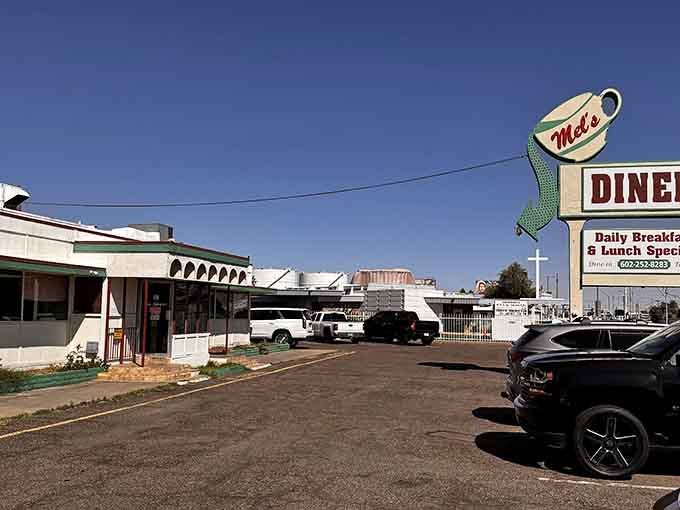 That giant coffee cup sign beckons like a lighthouse for hungry souls, promising comfort food and good times inside this Phoenix treasure.