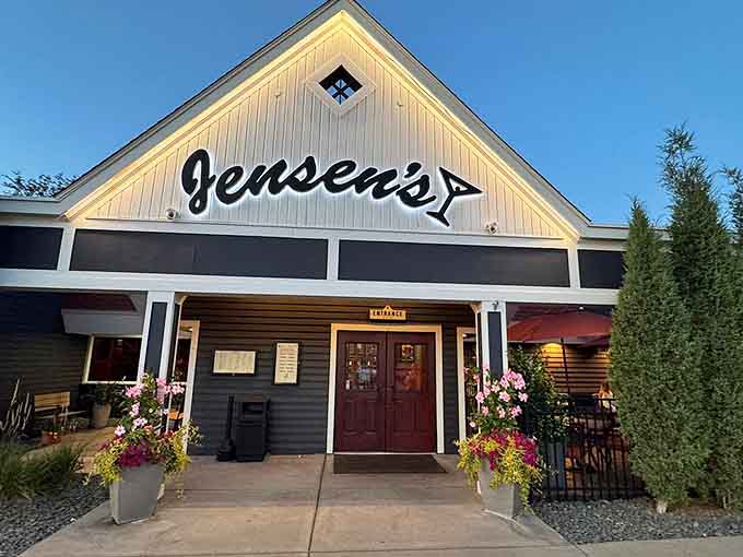 The welcoming exterior of Jensen's promises classic supper club charm before you even step inside the doors.
