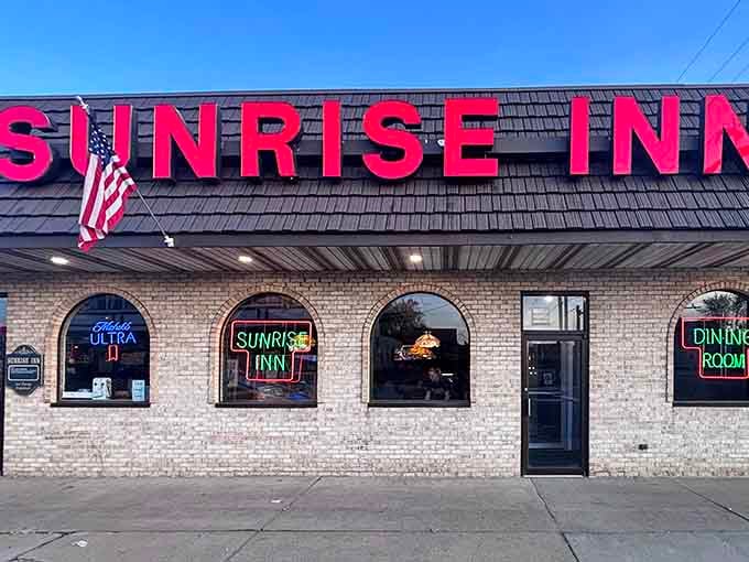 That bold red signage against the brick facade isn't just announcing a restaurant, it's marking the spot where Warren's pizza dreams come true.