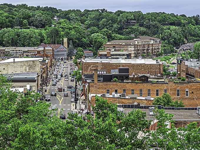 Stillwater rises from the St. Croix River valley like a postcard that somehow became three-dimensional and infinitely more charming than any photograph could capture.