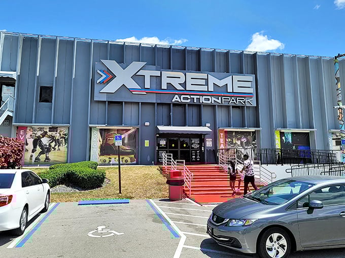 The imposing silver facade of Xtreme Action Park promises adventure before you even step through those bright red doors.