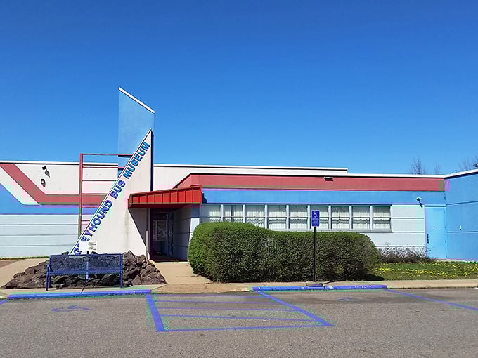 The distinctive blue and red exterior of the Greyhound Bus Museum stands as a beacon to transportation enthusiasts in Hibbing, Minnesota.