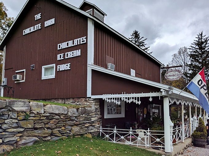 The rustic brown exterior of The Chocolate Barn beckons chocolate lovers with its charming country appeal and promise of sweet treasures within.