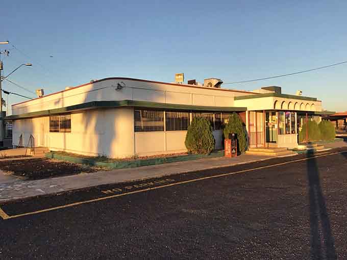 That classic mid-century architecture and vintage signage practically scream "pull over for breakfast," and you should absolutely listen to those screams.
