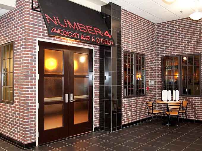 That glowing neon sign beckons like a beacon of deliciousness in downtown Mankato, promising steaks and secrets within.