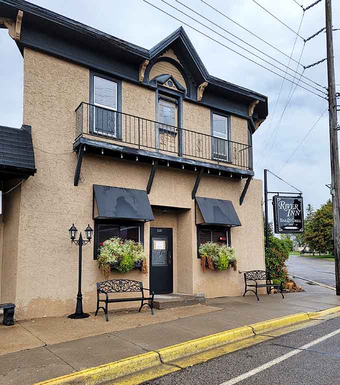 The charming exterior of River Inn Bar & Grill beckons like an old friend, promising good times and even better food inside.