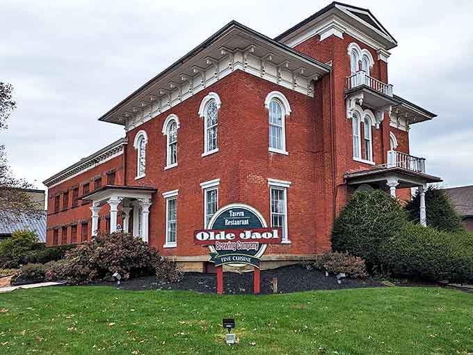 The stately red brick exterior of The Olde Jaol stands proudly in Wooster, its white trim and ornate details hinting at its fascinating past as the county jail.