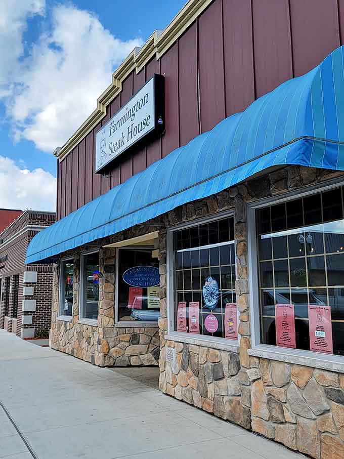 The stone facade and bright blue awning signal you've arrived at steak paradise in downtown Farmington.