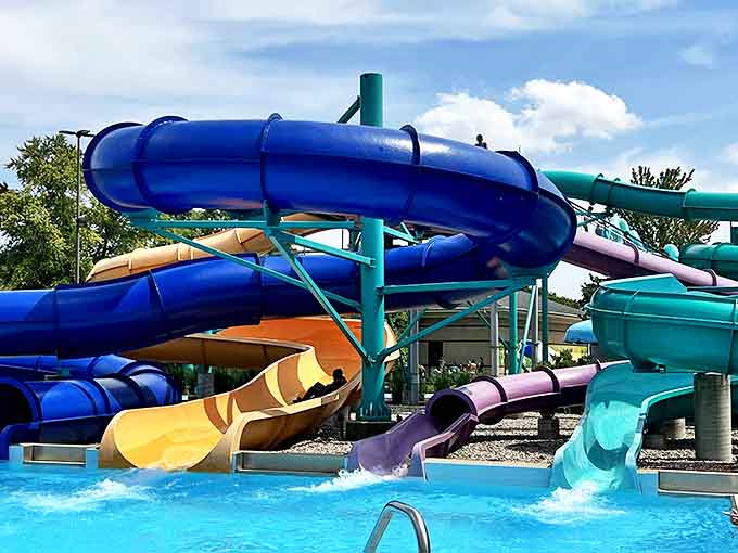 Those colorful slides twisting through the sky like a rainbow had a baby with a roller coaster, promising thrills that'll make your stomach do backflips.