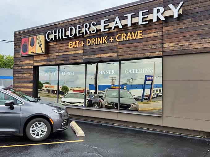 The modern exterior with its distinctive wood paneling makes Childers Eatery easy to spot, promising comfort food adventures within.