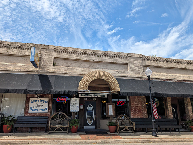 Conestogas Restaurant stands proudly on Alachua's Main Street, its brick facade and rustic wagon wheels promising authentic comfort food within.