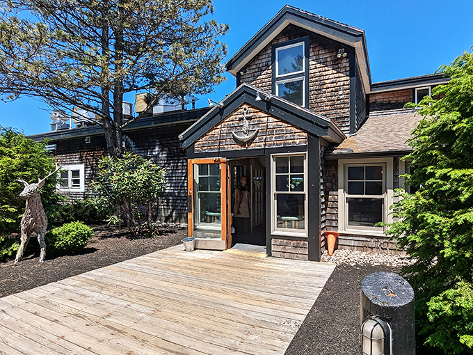 The weathered cedar shingles and welcoming entrance of Royal River Grill House promise coastal charm before you even step inside.