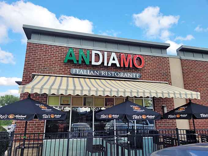 That striped awning and brick facade practically whisper "authentic Italian food inside," and for once, the promise is actually kept.