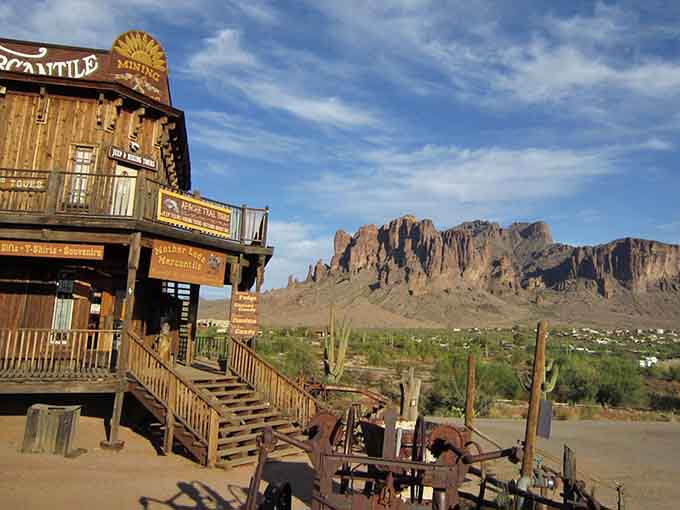 The Mother Lode Mercantile stands proud against those legendary Superstition Mountains, looking exactly like every Western movie set you've ever loved, except this one actually sells fudge.
