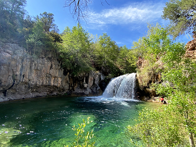 Fossil Creek Waterfall: Nature's perfect infinity pool &ndash; turquoise waters cascade over travertine ledges, creating a swimmer's paradise hidden in Arizona's wilderness.