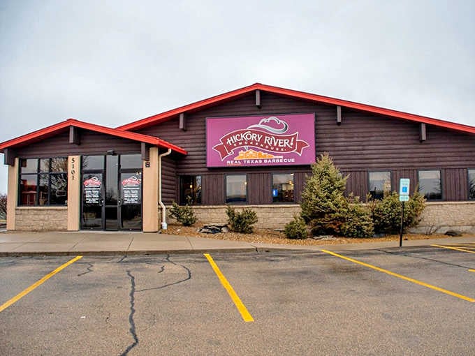 Where barbecue dreams come true &ndash; Hickory River's rustic wooden exterior with signature red trim promises smoky delights within.