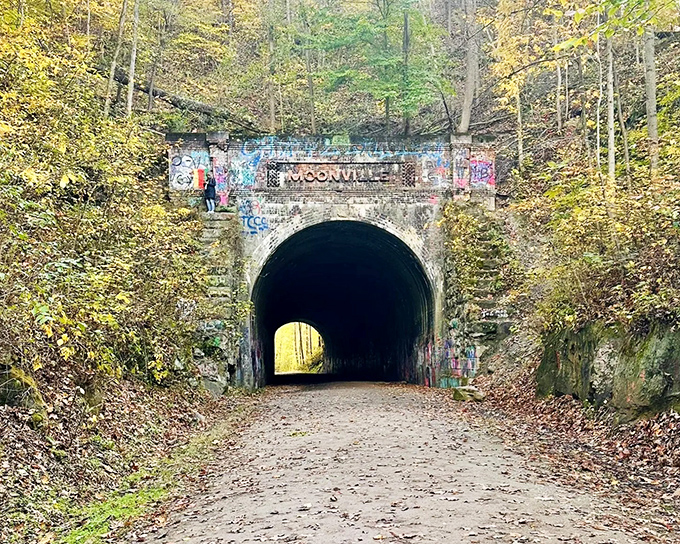 The entrance to Moonville Tunnel stands like a portal to another time, graffiti adding colorful chapters to its storied past.