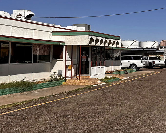 The unassuming exterior of Mel's Diner stands like a time capsule in Phoenix, promising comfort food treasures within its modest walls.