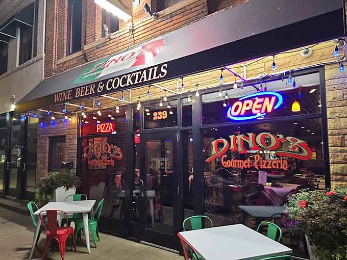 That neon "OPEN" sign glowing like a beacon of hope for hungry pizza lovers everywhere, promising carbs and cheese just beyond those doors.