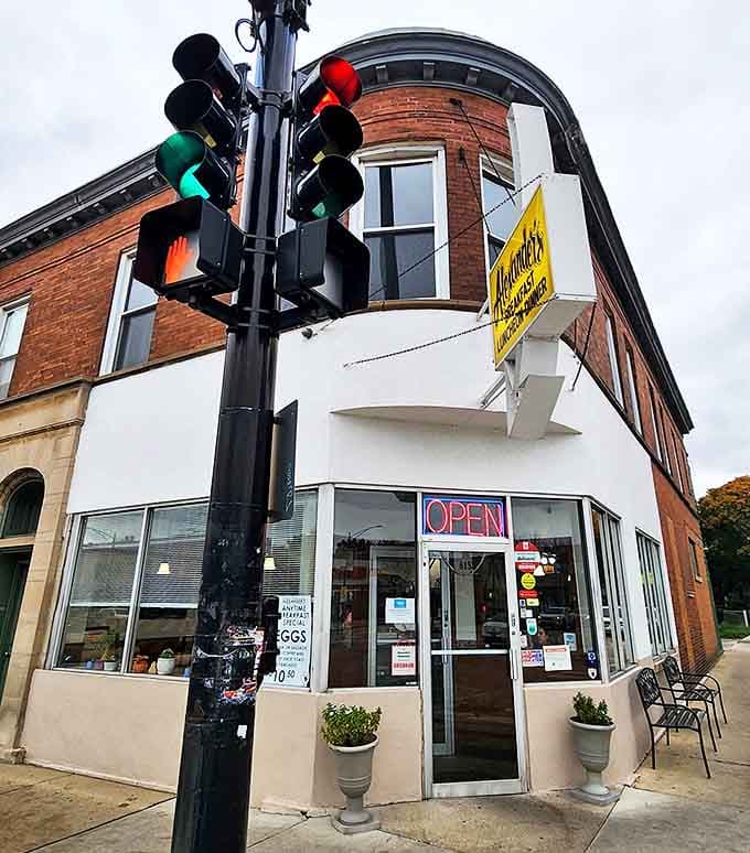 Alexander's corner location stands like a time capsule at Irving Park and Keeler, its yellow sign a beacon for hungry Chicagoans seeking authentic diner comfort.
