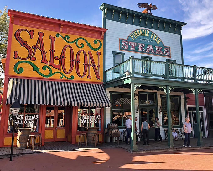 The vibrant "SALOON" sign and mint-green "STEAKS" facade promise an authentic Western experience that'll transport you faster than any time machine could.