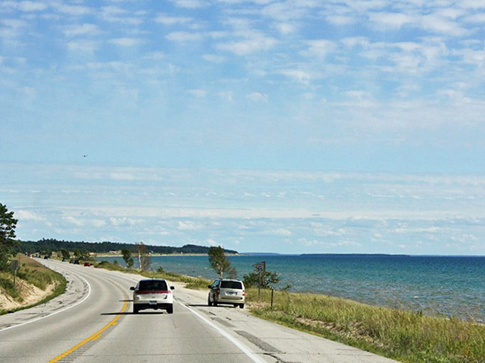 US-2 hugs Lake Michigan's shoreline like a long-lost friend, offering views that make smartphone cameras work overtime.