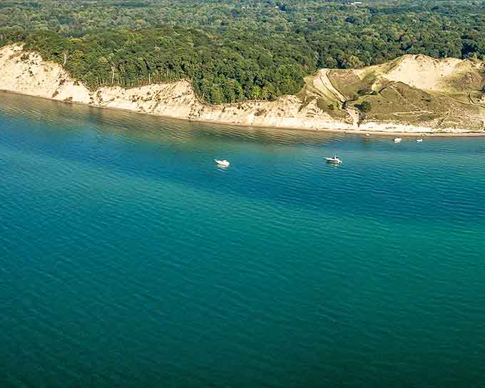 Van Buren State Park: Where Michigan's natural beauty takes center stage, welcoming visitors with its rustic stone entrance and promise of lakeside adventures.