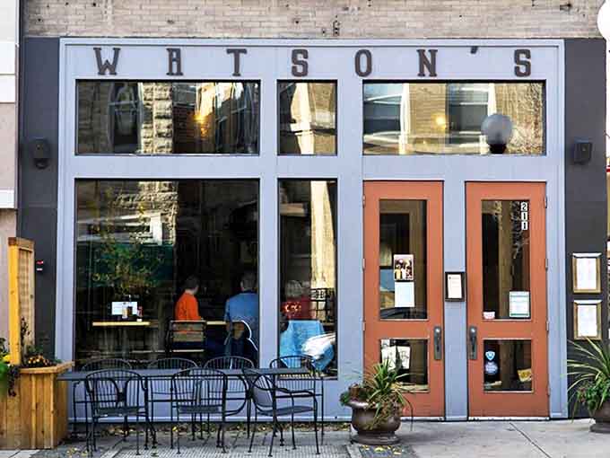 Watson's welcoming storefront beckons hungry passersby with its understated charm and promise of chicken paradise within those copper-colored doors.
