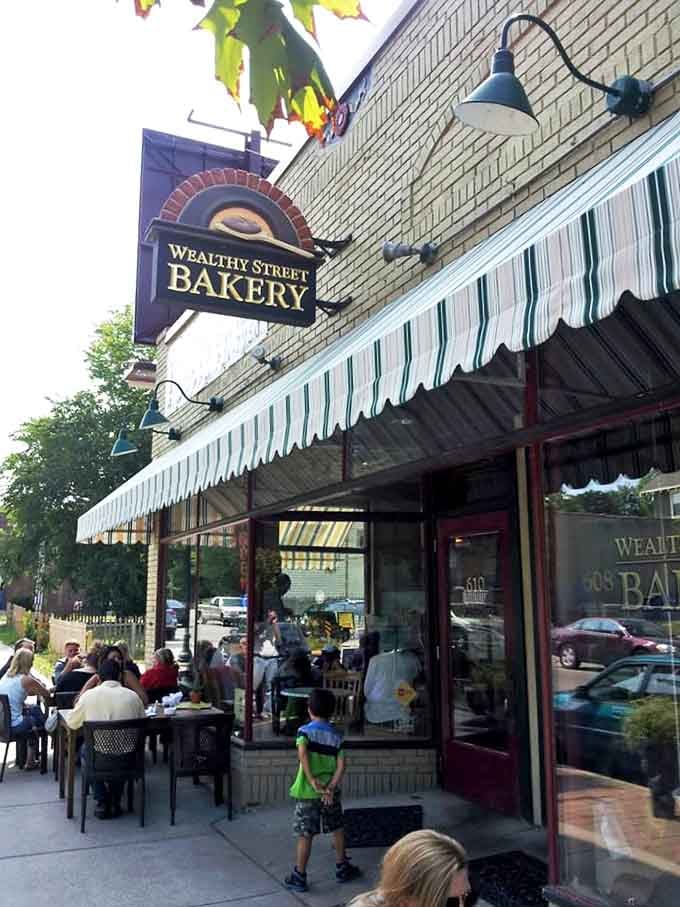 The iconic Wealthy Street Bakery sign welcomes carb enthusiasts and coffee lovers alike to this Grand Rapids institution where pastry dreams come true.