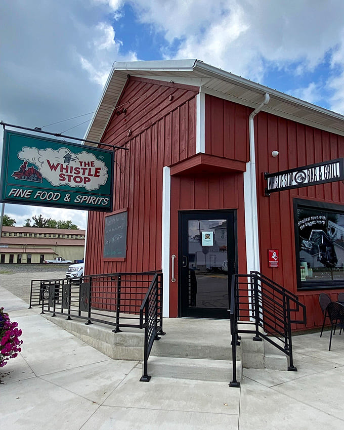 The Whistle Stop's bright red exterior stands like a beacon of culinary promise in Ansonia, its vintage train-themed sign hinting at the treasures within.
