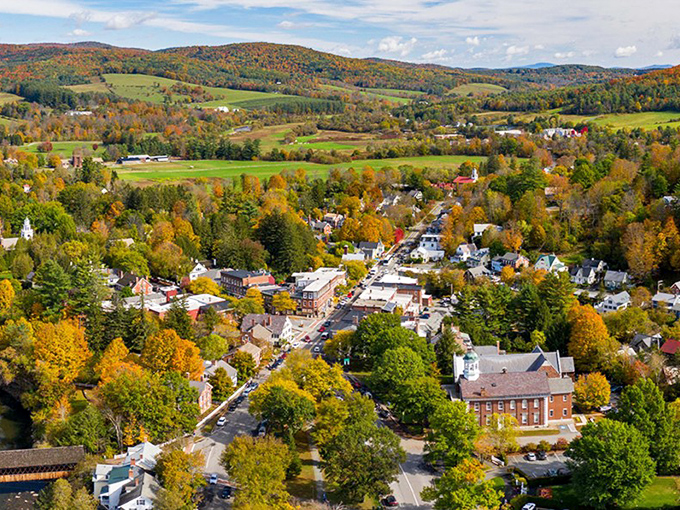 A bird's-eye view of Vermont's most photogenic village, where autumn paints the surrounding hills in nature's most extravagant color palette.