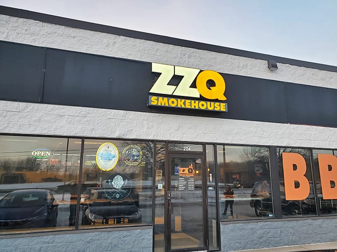 ZZQ Smokehouse: Where that bright orange BBQ sign isn't just advertising – it's a beacon of hope for hungry souls seeking smoky salvation.