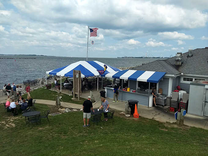 Dockside Cafe's blue and white striped awning flutters in the lake breeze, welcoming hungry visitors to this waterfront gem in Sandusky.