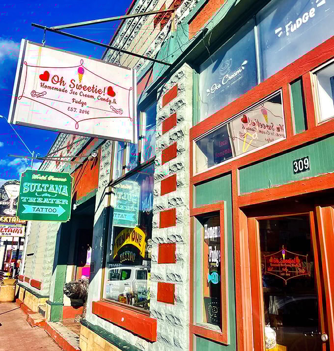 The charming exterior of Oh Sweetie! beckons with its vintage sign and distinctive stone facade &ndash; resistance is futile for sweet-seekers passing by.
